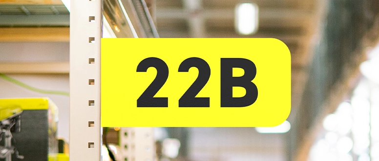 Warehouse Aisle Signs mounted on uprights or hanging from above